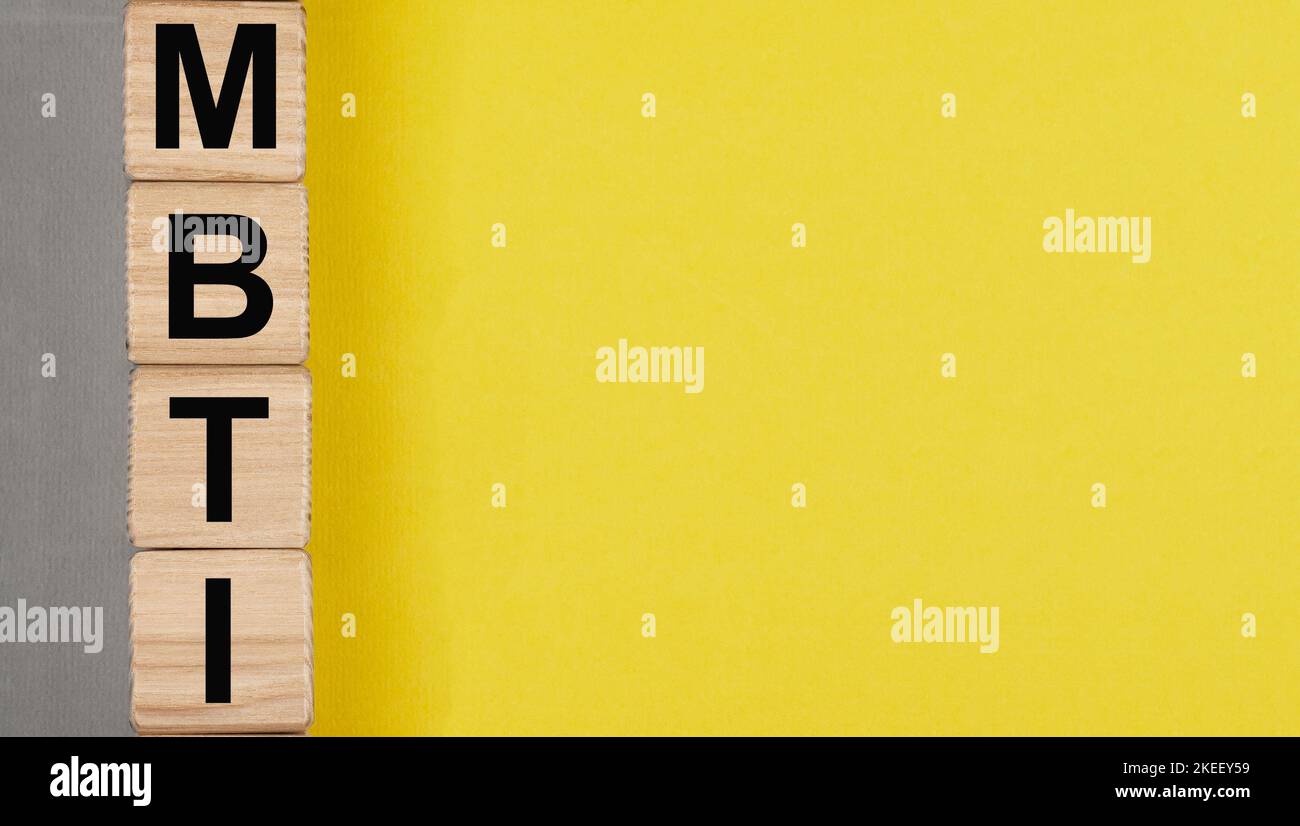 MBTI types test, letters on yellow and gray background with copy space ...