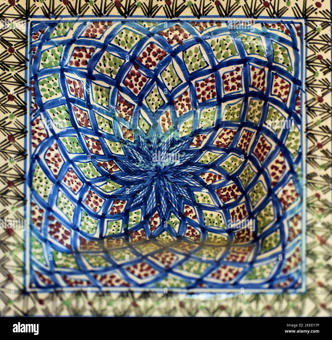 Traditional painted ceramic plate sold as a souvenir in the stores of ...