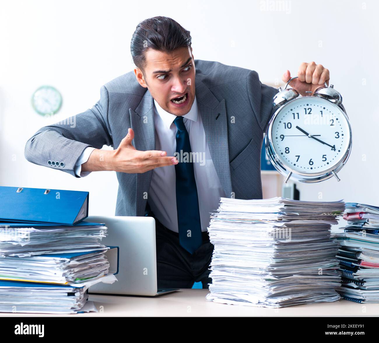 The businessman with heavy paperwork workload Stock Photo - Alamy