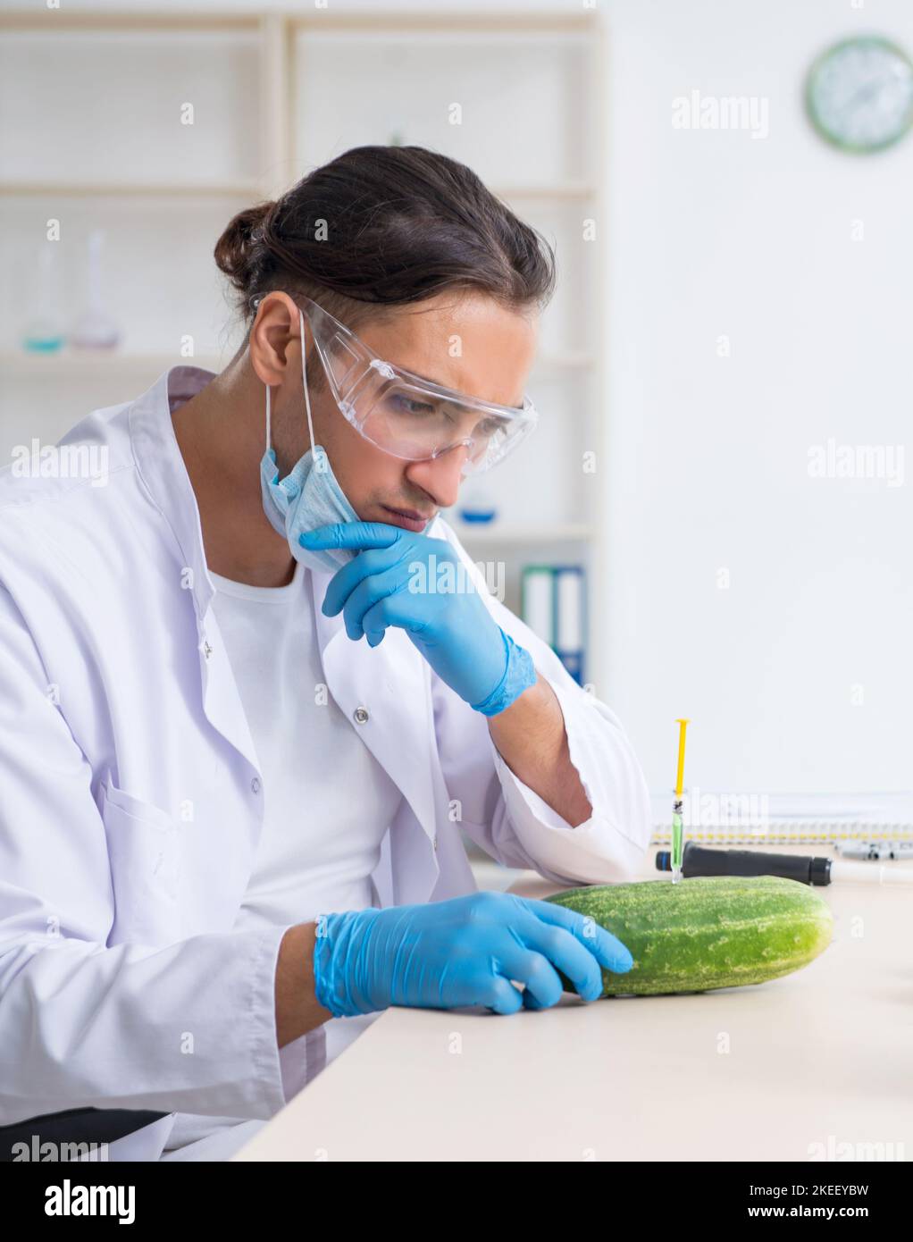The male nutrition expert testing vegetables in lab Stock Photo - Alamy
