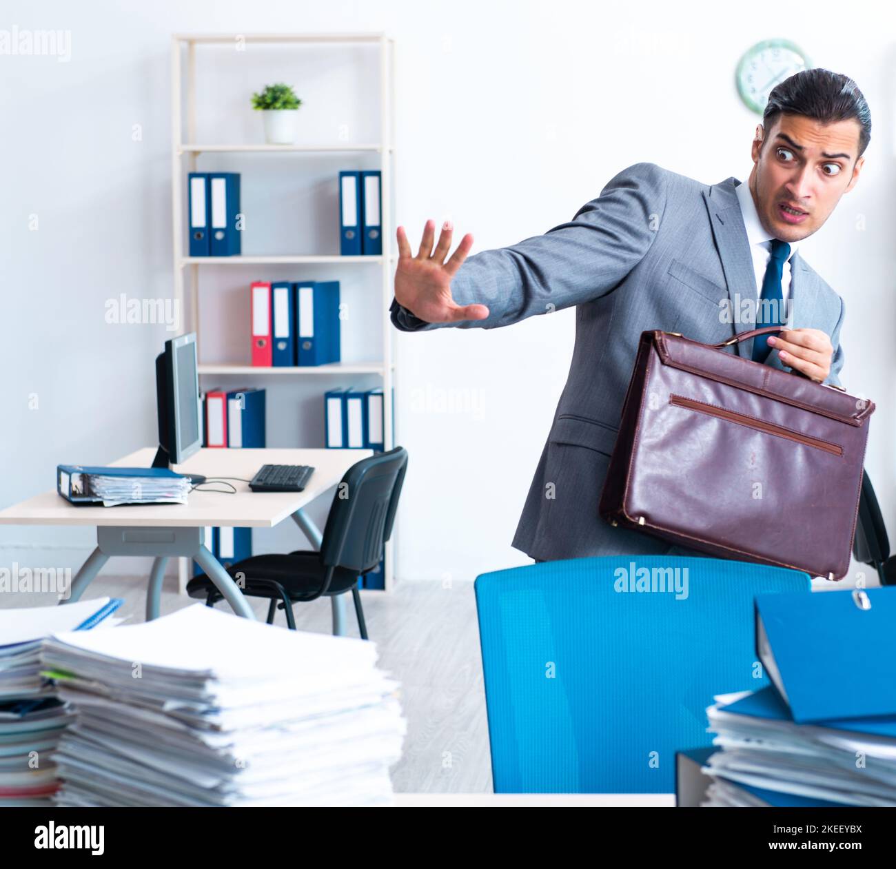 The businessman with heavy paperwork workload Stock Photo - Alamy