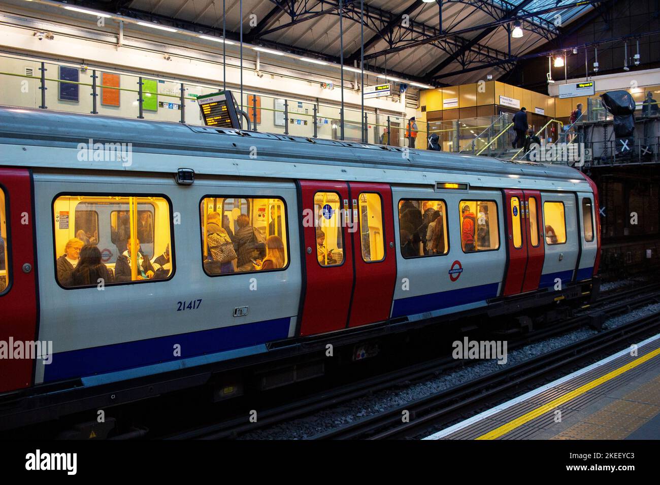 London Underground (the Tube); a train on the District Line stopping at ...