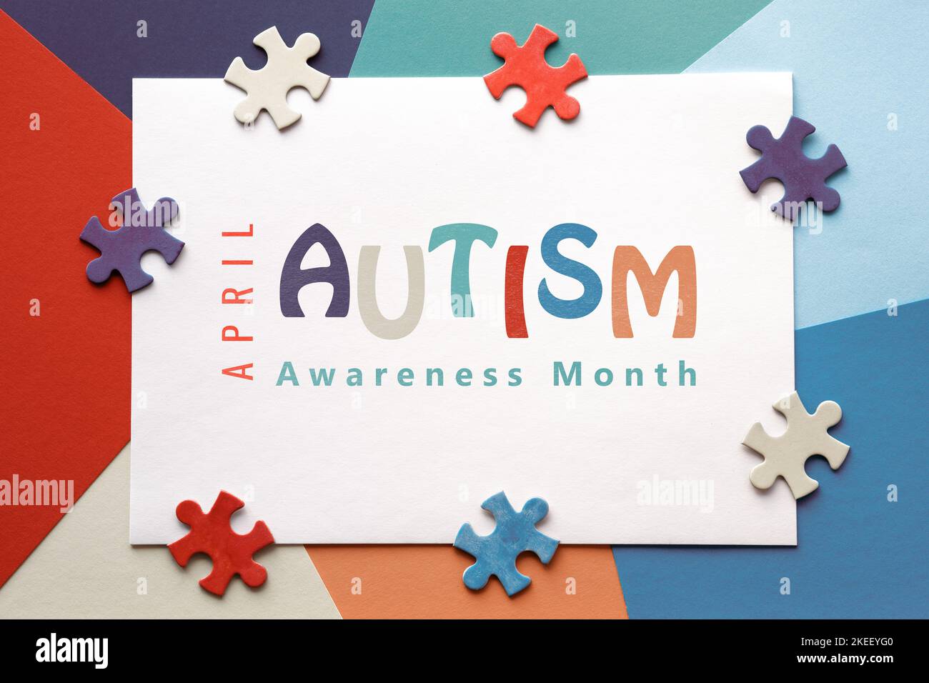 Text April, World Autism Awareness Month, frame with puzzle pieces ...