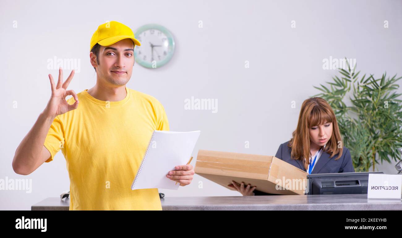 Male receptionist receiving payment hi-res stock photography and images ...