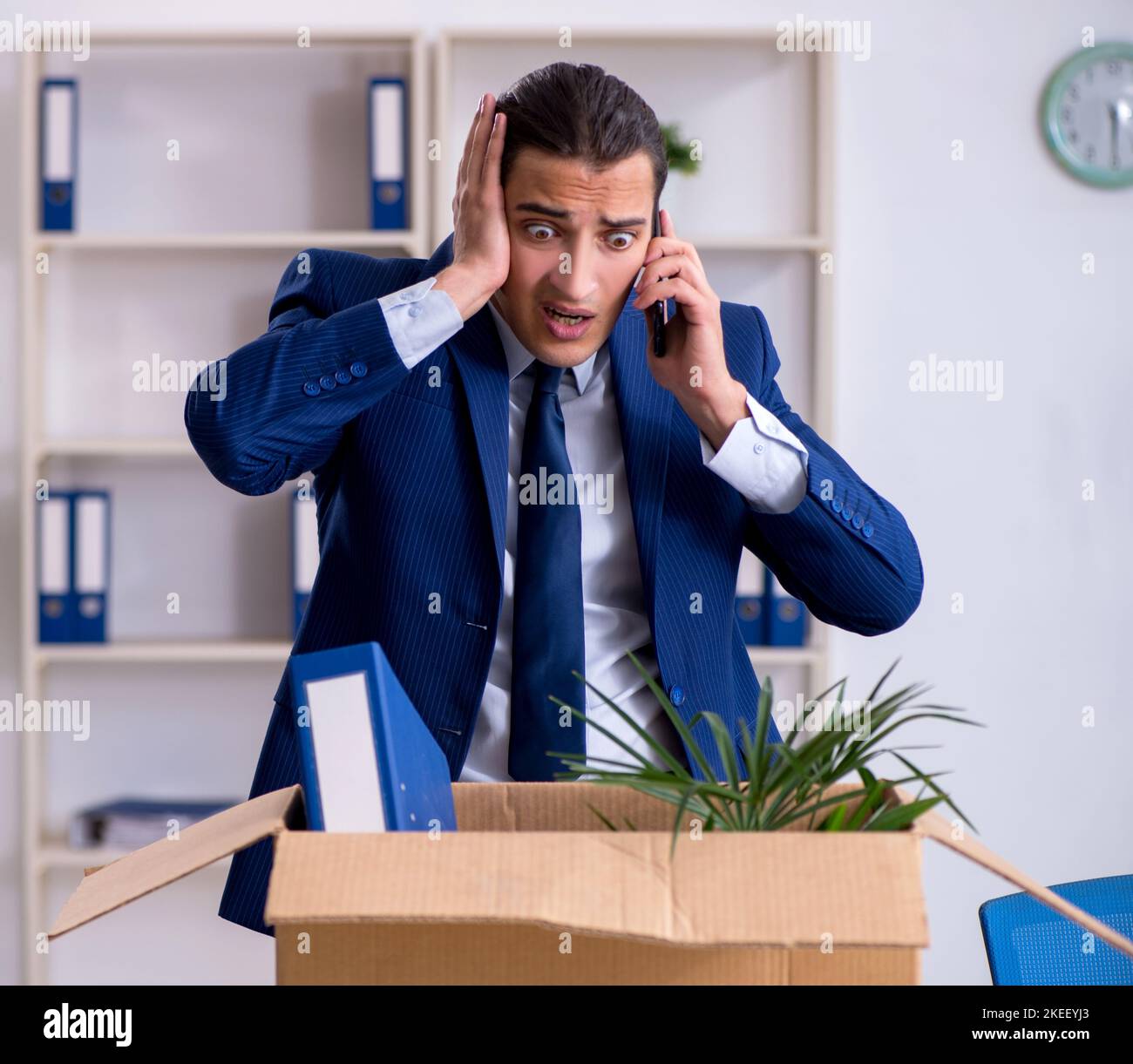 The young employee being made redundant Stock Photo - Alamy