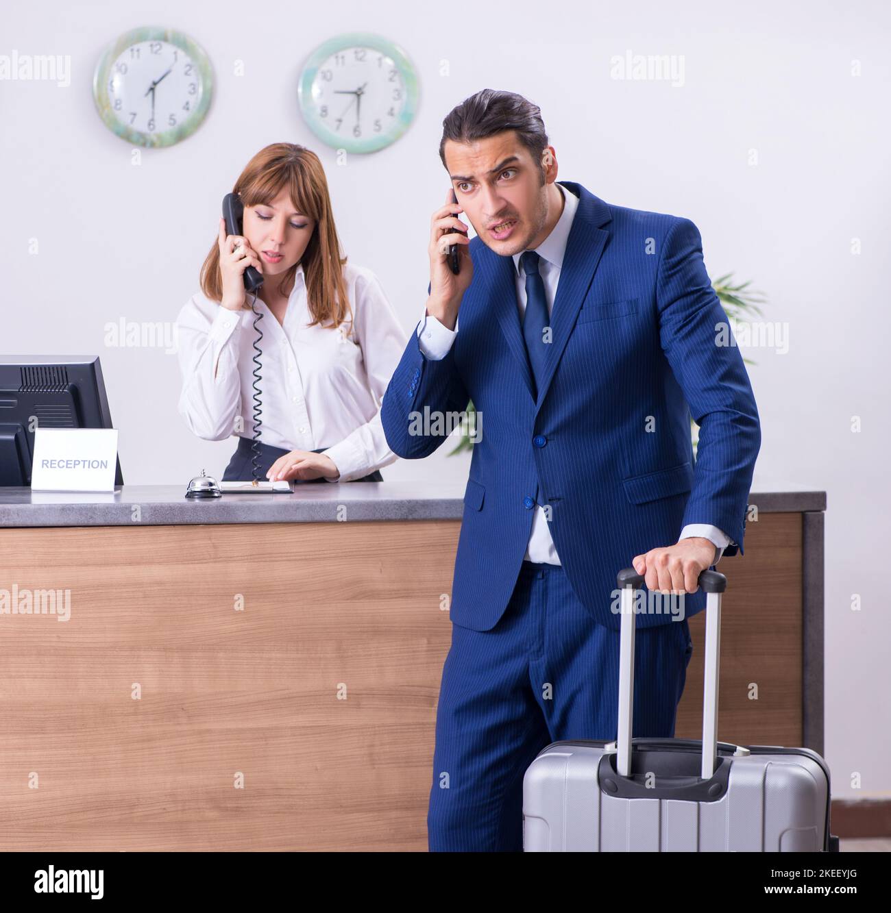 Woman hotel reception angry hi-res stock photography and images - Alamy