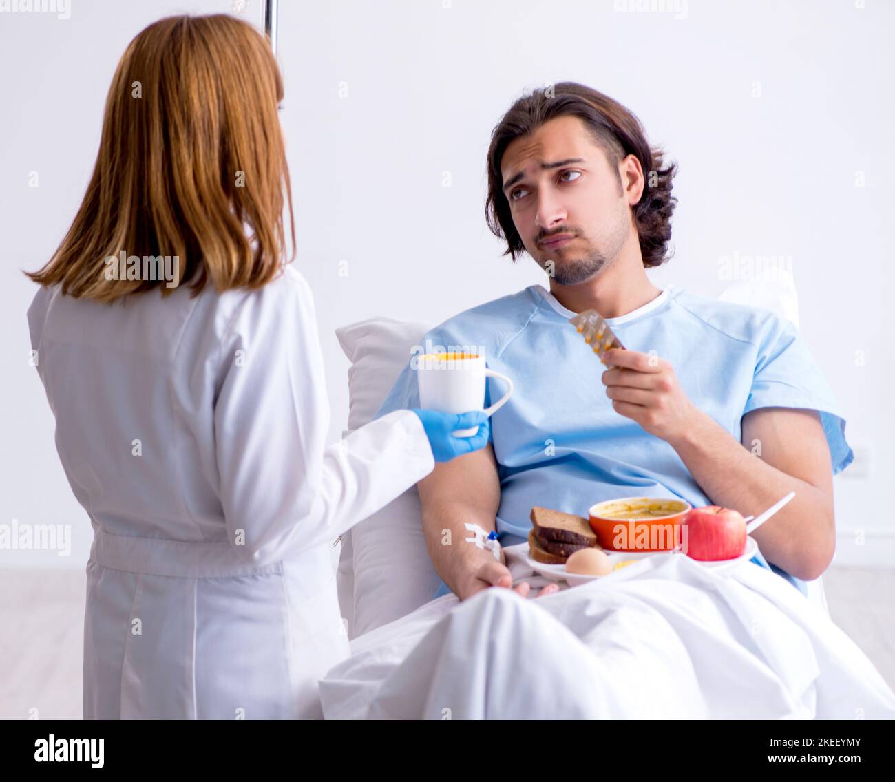 The male patient eating food in the hospital Stock Photo - Alamy