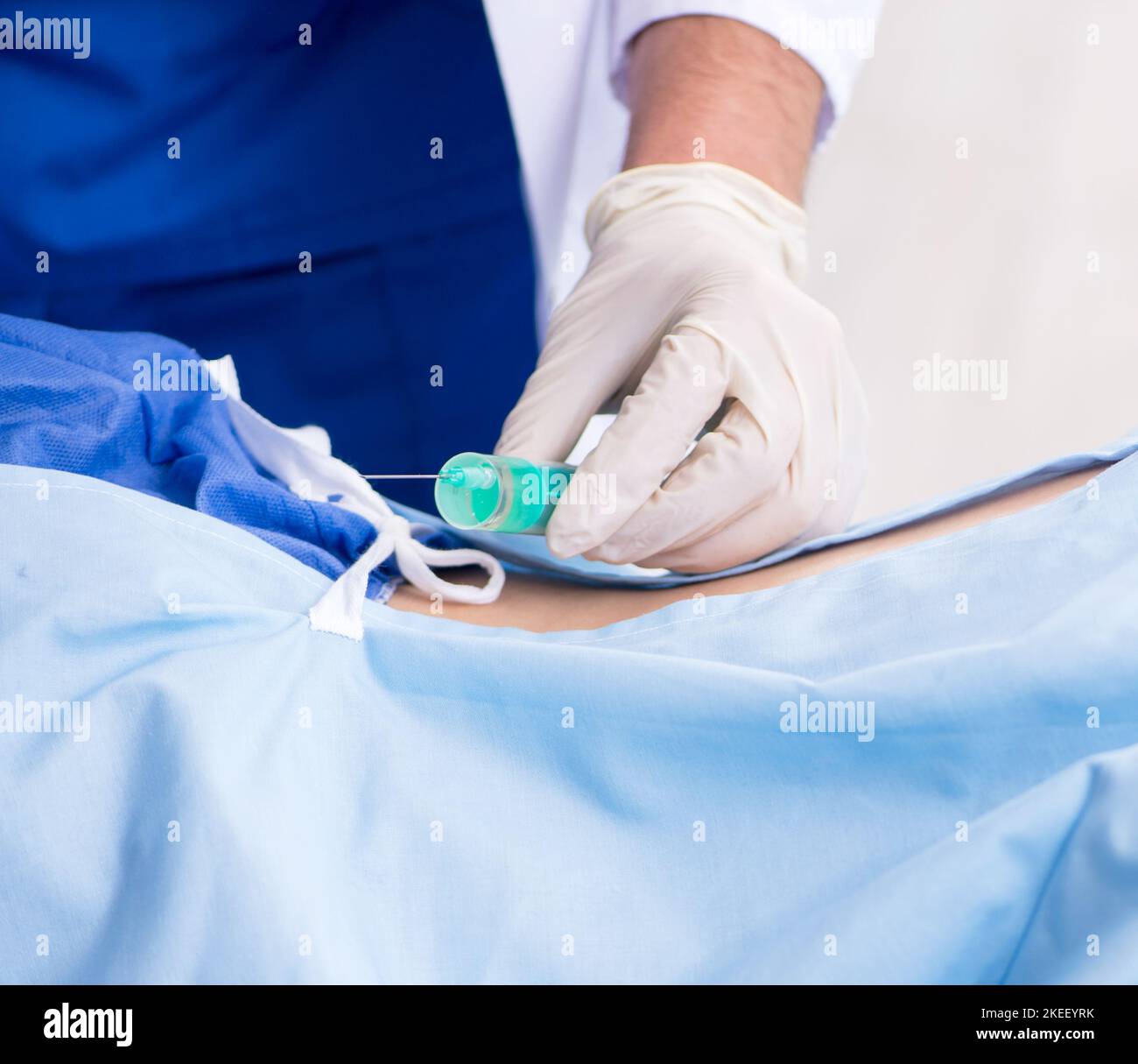 The female patient getting an injection in the clinic Stock Photo - Alamy