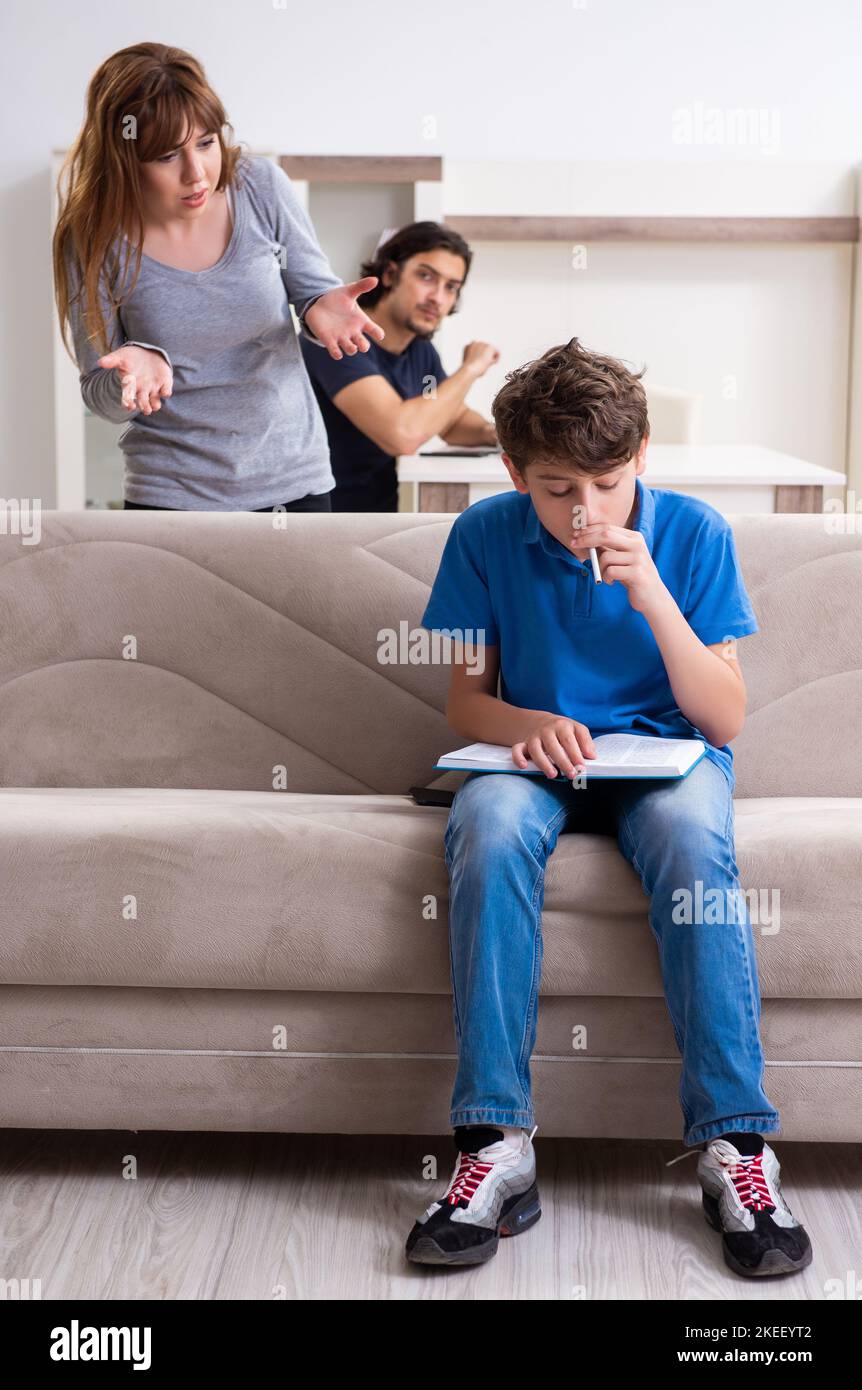 The concept of underage smoking with young boy and family Stock Photo ...