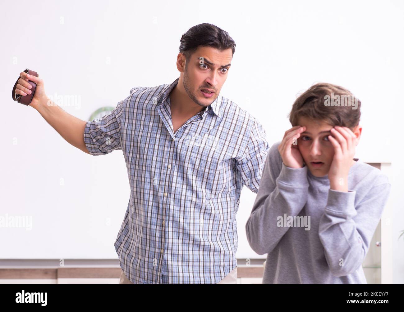The father beating and punishing his sone Stock Photo - Alamy