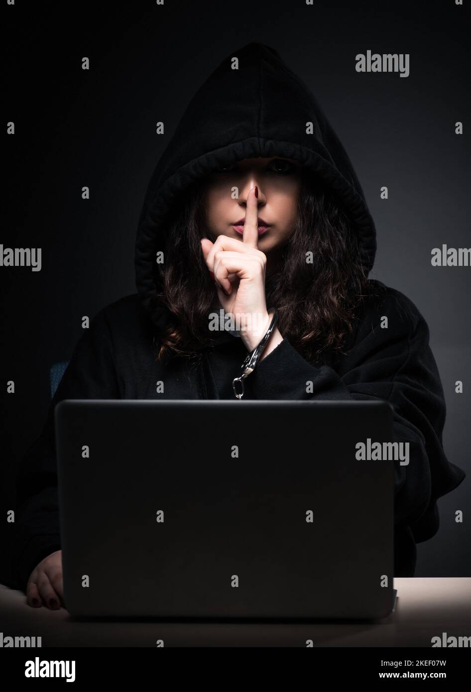 The female hacker hacking security firewall late in office Stock Photo ...