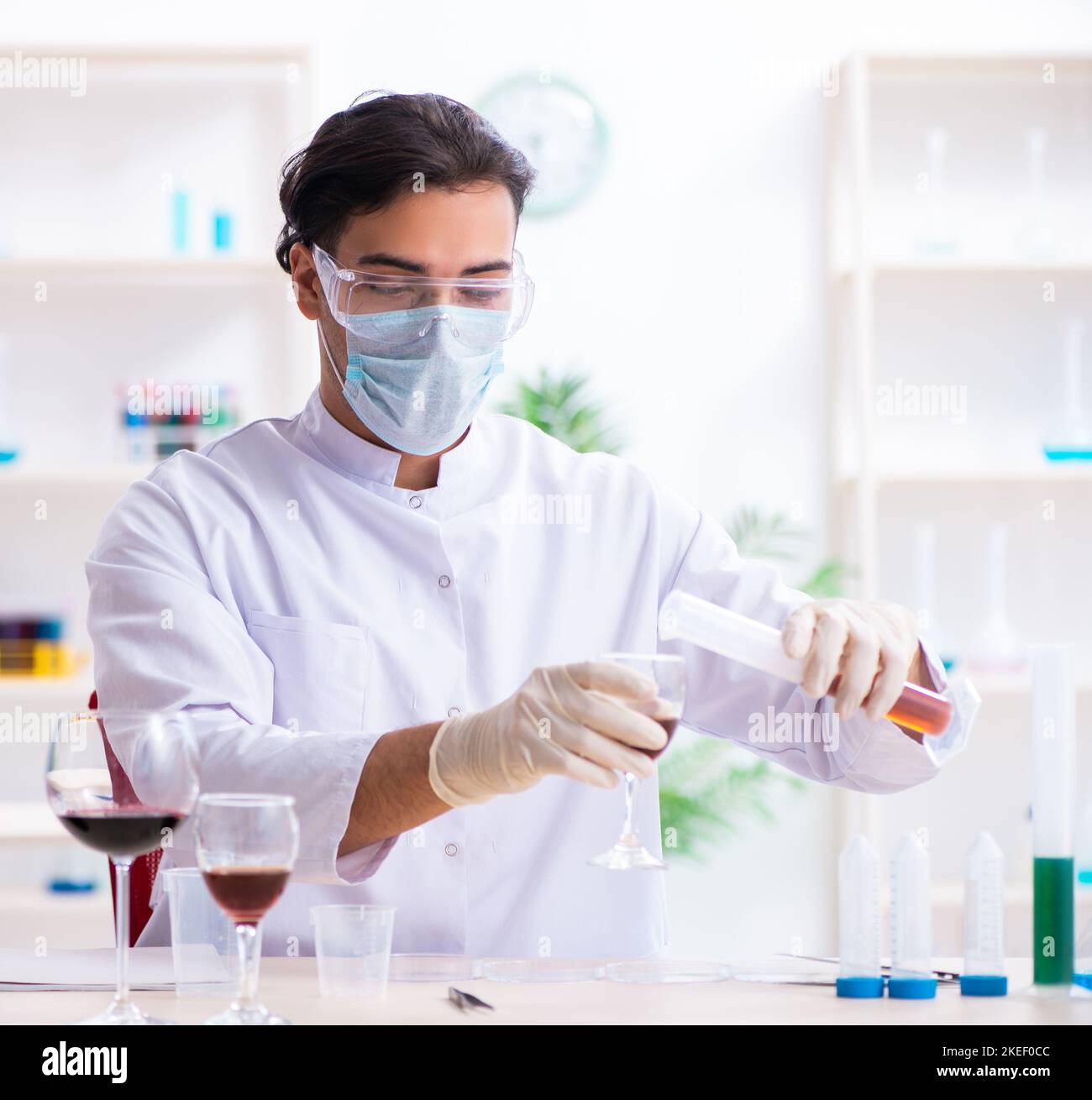 The male chemist examining wine samples at lab Stock Photo - Alamy