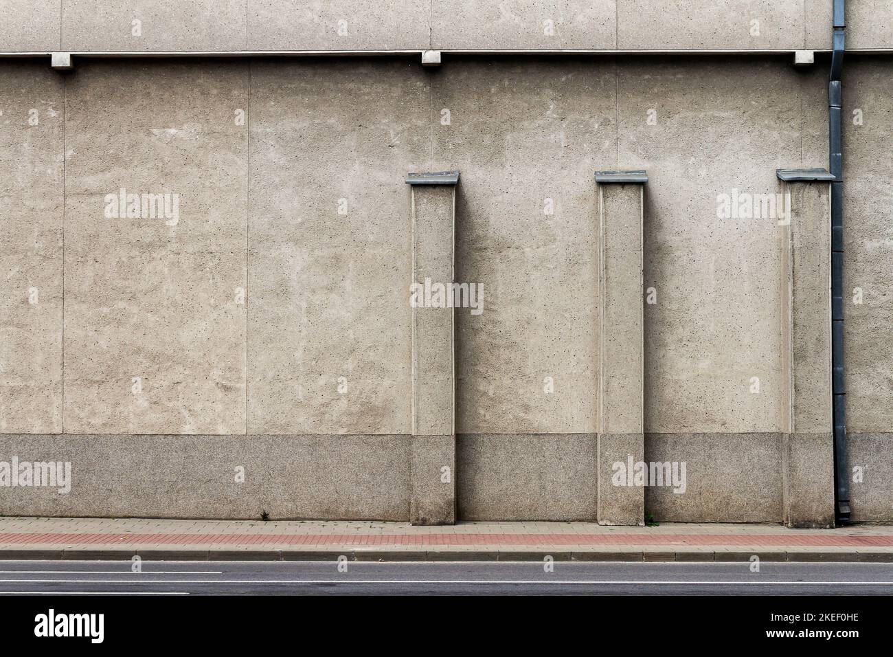 Aged weathered street wall with some columns Stock Photo - Alamy