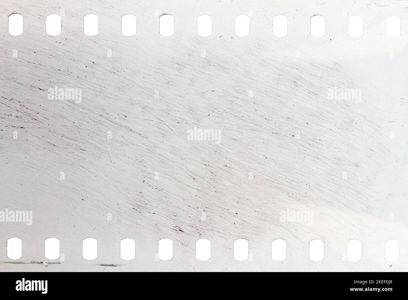 Dusty and grungy 35mm film texture or surface. Perforated scratched ...