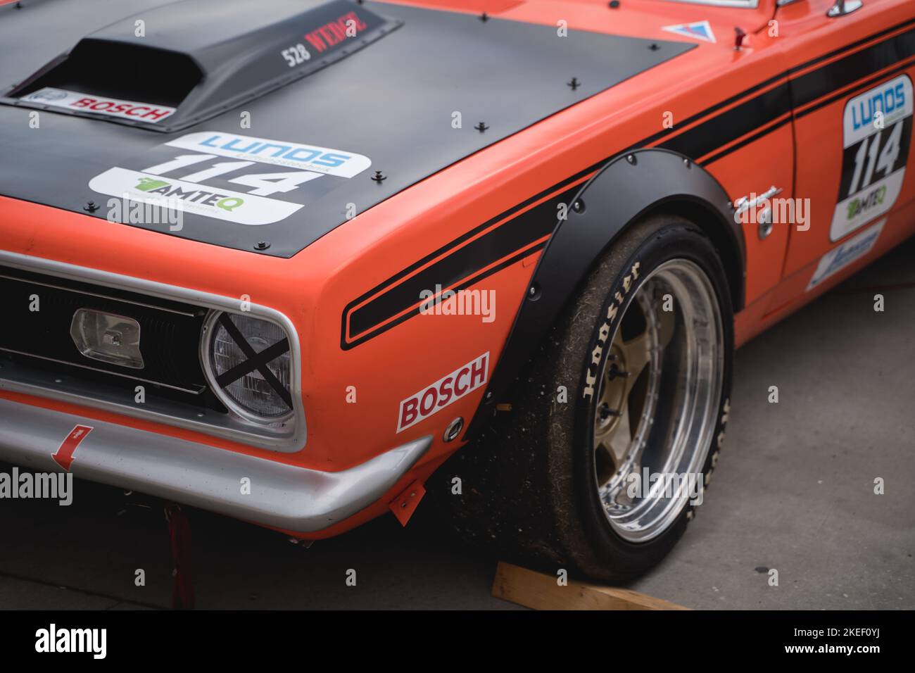 A closeup of an old-school racing v8 supercar Stock Photo - Alamy