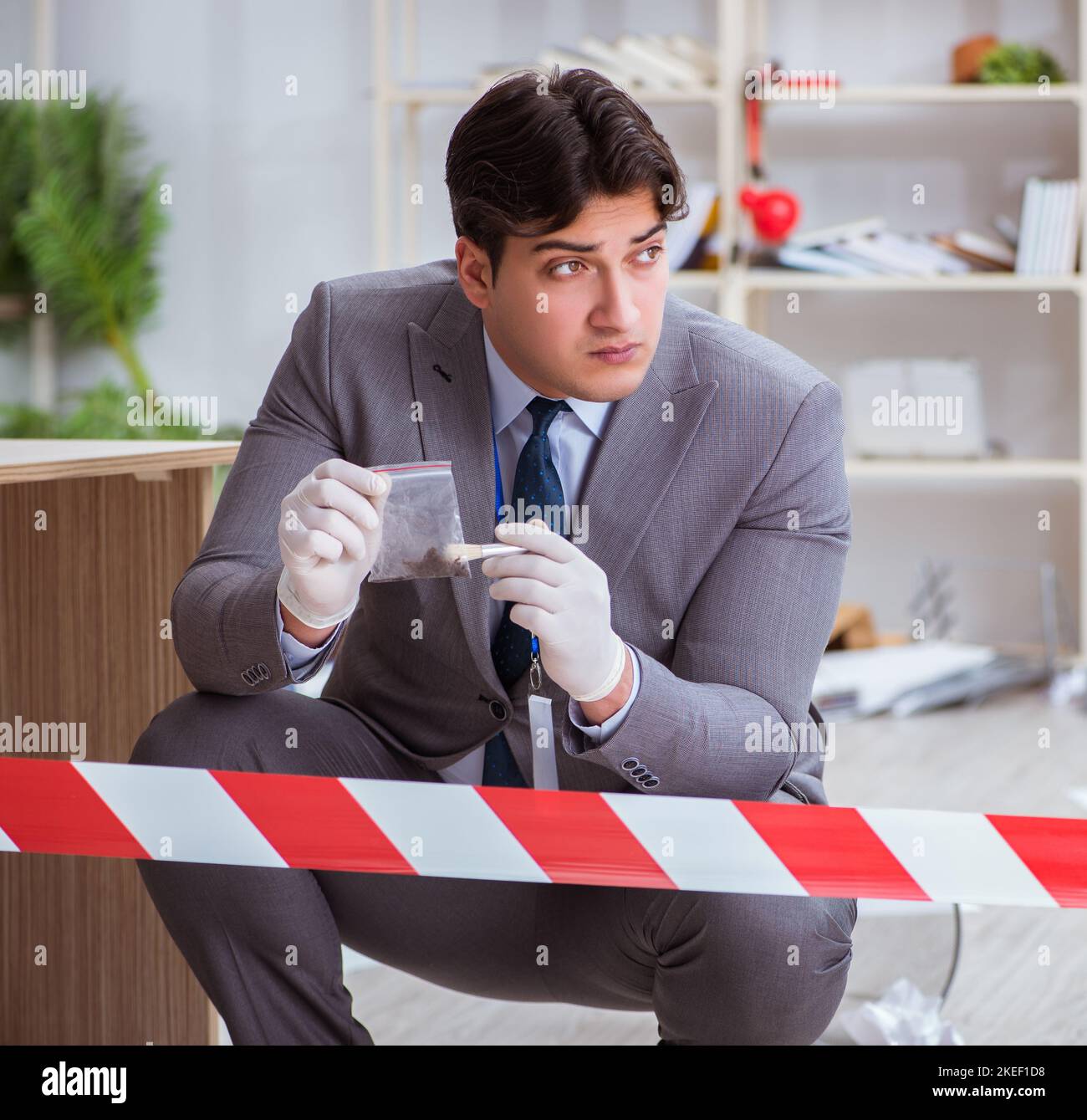 The young man during crime investigation in office Stock Photo - Alamy
