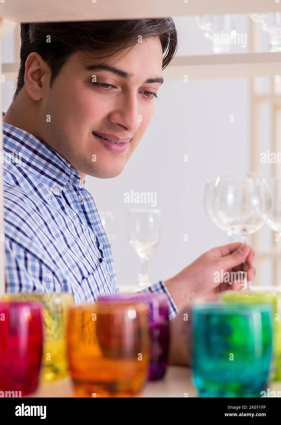 The young handsome man shopping in shop Stock Photo - Alamy