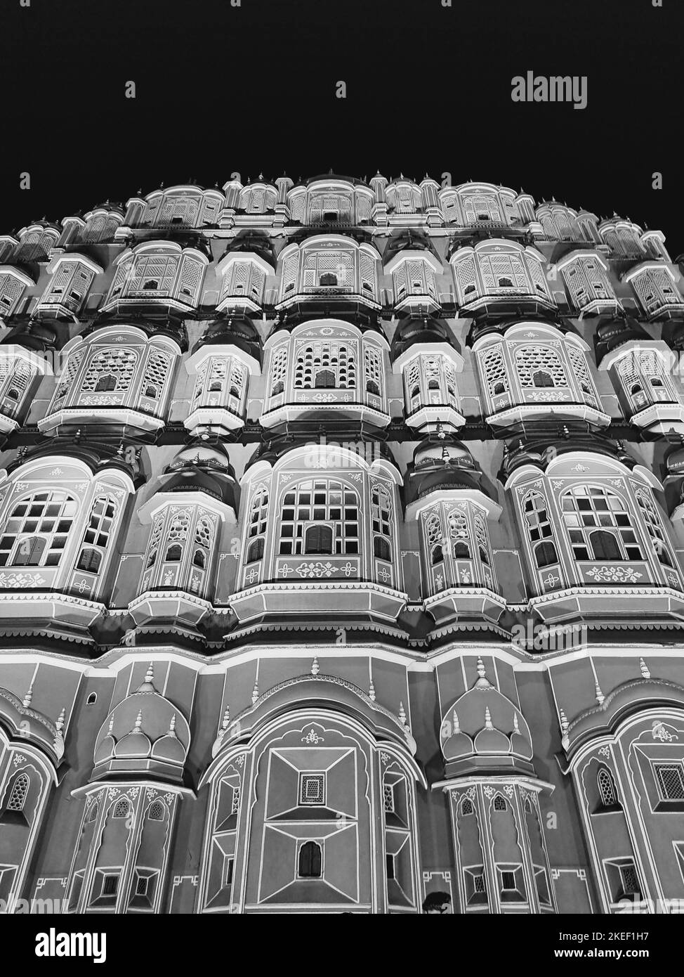 A vertical grayscale of the Hawa Mahal Palace in Jaipur India with ...