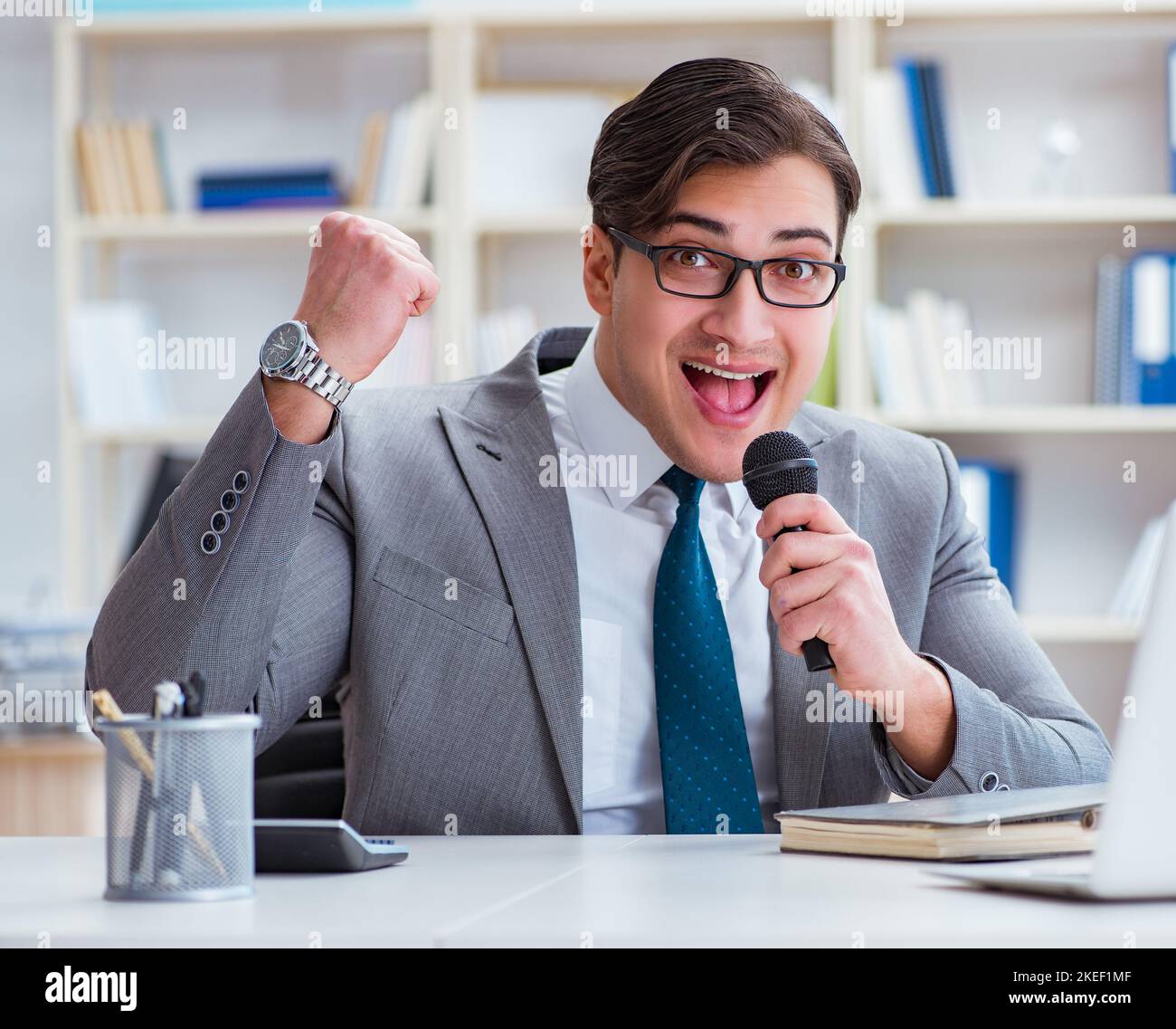The businessman singing in the office Stock Photo - Alamy