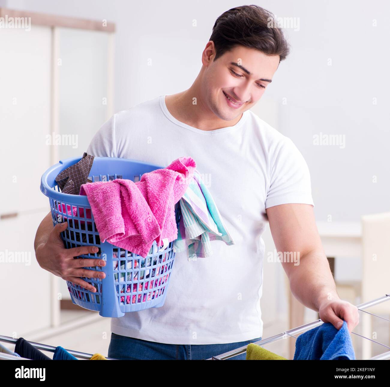 The man doing laundry at home Stock Photo - Alamy
