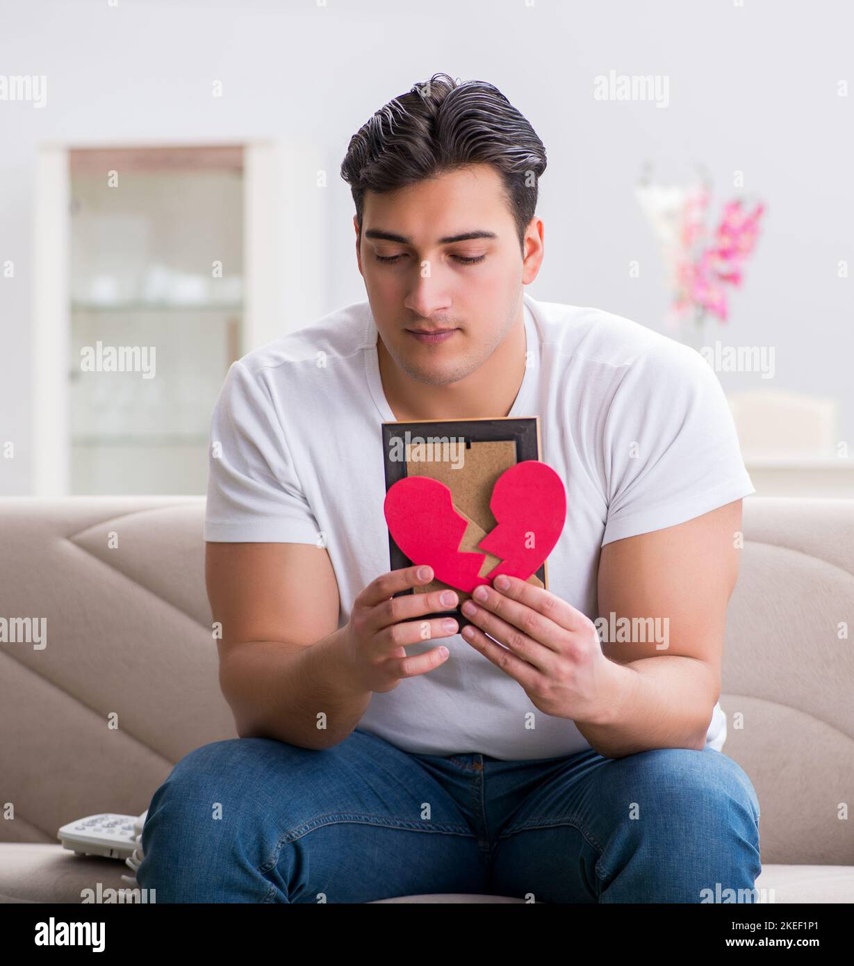 The young man in sad saint valentine concept Stock Photo - Alamy
