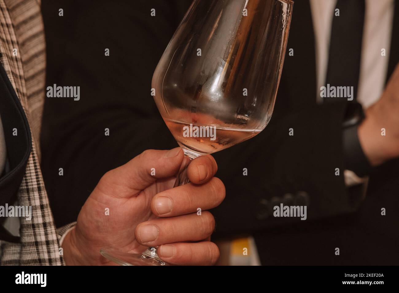 Glass of rose wine tasting with friends and wine lovers Stock Photo - Alamy