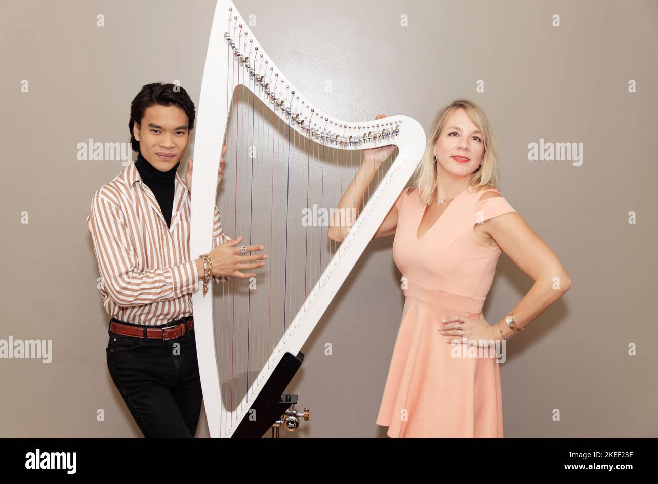 Paris, France. 11th Nov, 2022. Model Jeremy Bellet and harpist, singer, Marie Nicot pose for ...