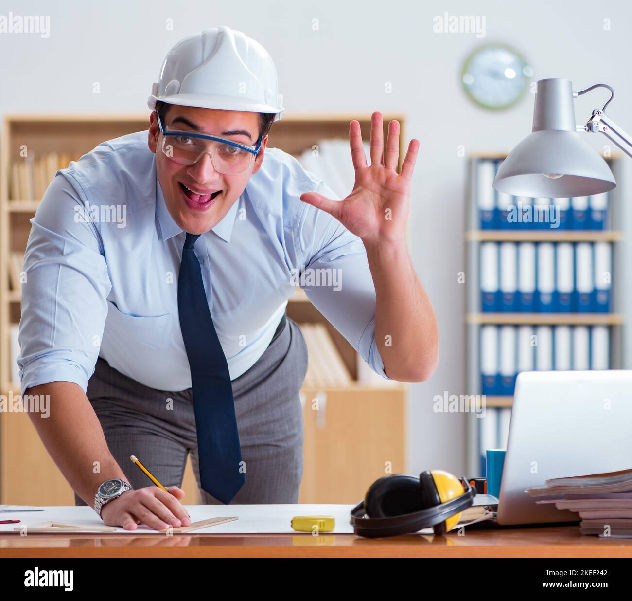 The engineer supervisor working on drawings in the office Stock Photo ...