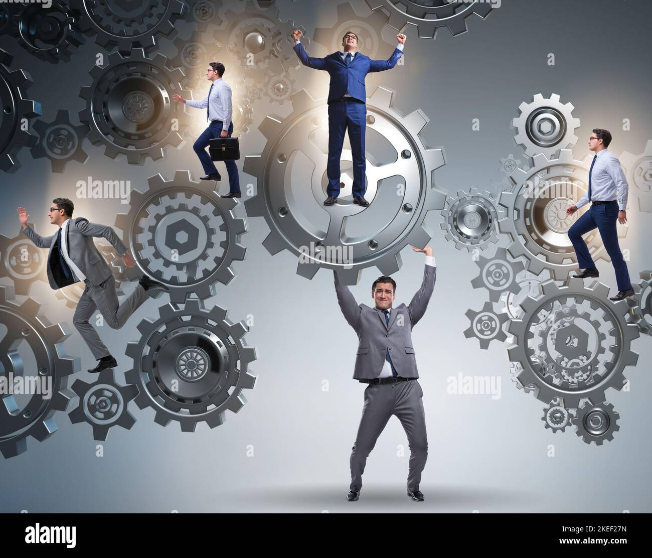 The businessman supporting gear in teamwork concept Stock Photo - Alamy