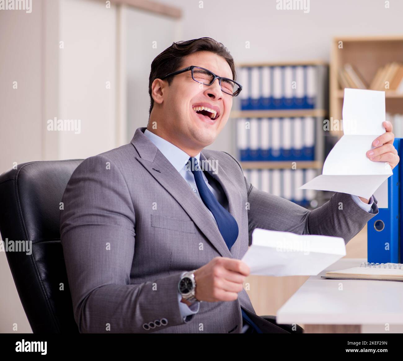 The businessman receiving letter in the office Stock Photo - Alamy