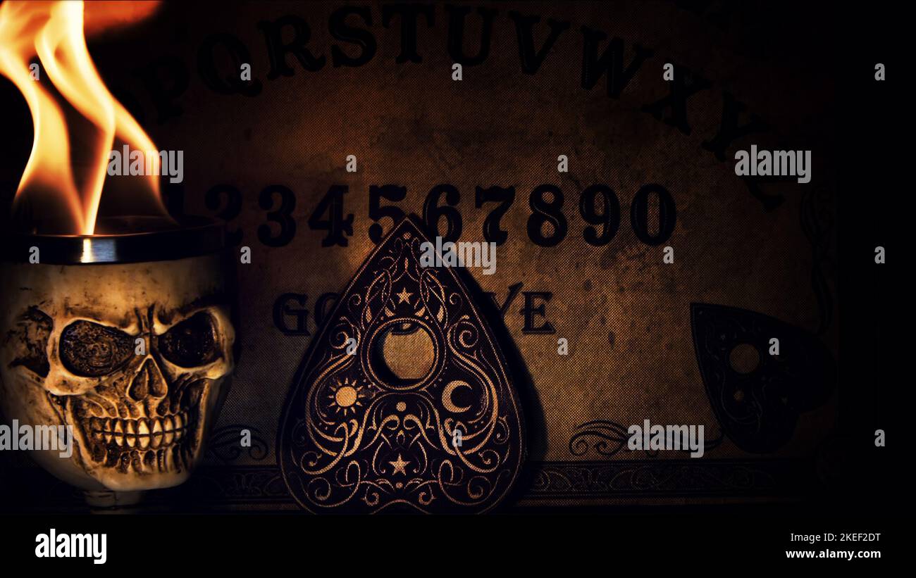 Ouija Witch Board and Skull Head on Fire Photo Stock Photo - Alamy