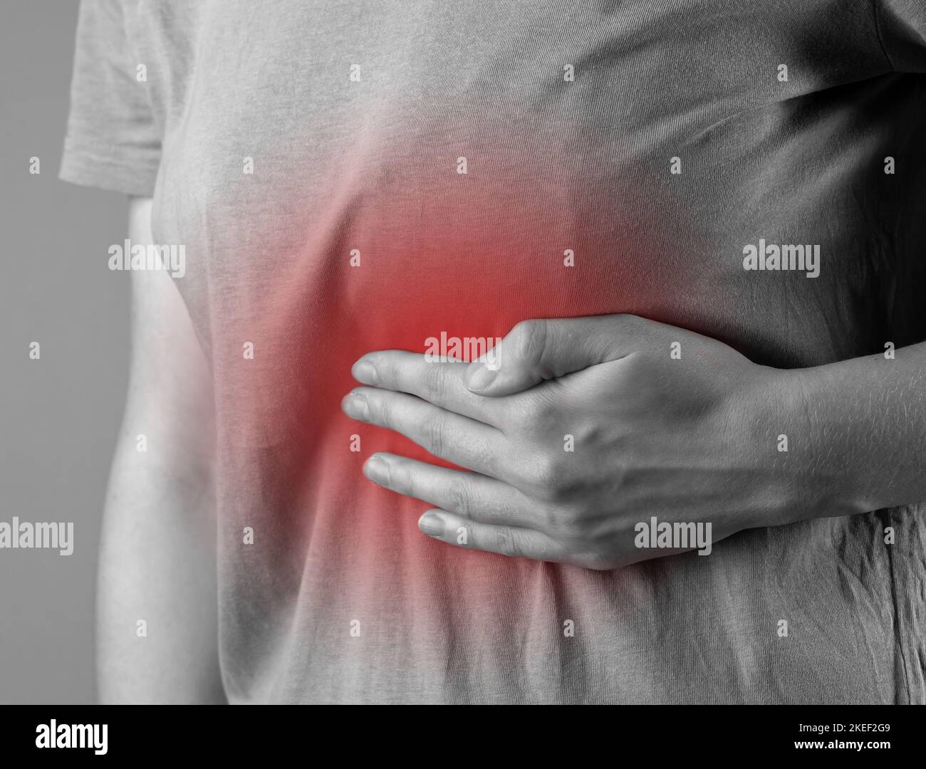 Old woman clutching her chest in pain hi-res stock photography and ...