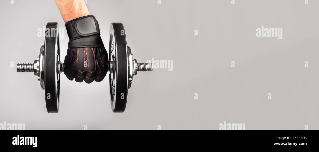 Hand in lifting weights, heavy dumbbell. Bodybuilding banner, ad ...