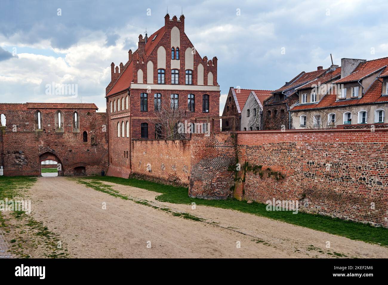 medieval brick walls and a historic tenement house in the city of Torun ...