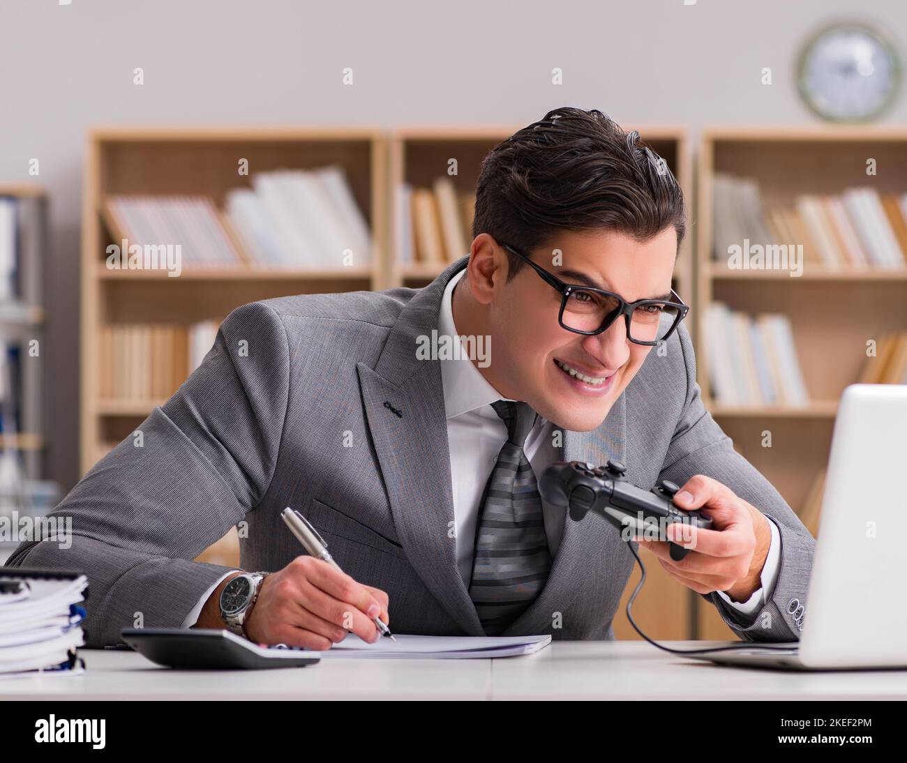 The businessman playing computer games at work office Stock Photo - Alamy