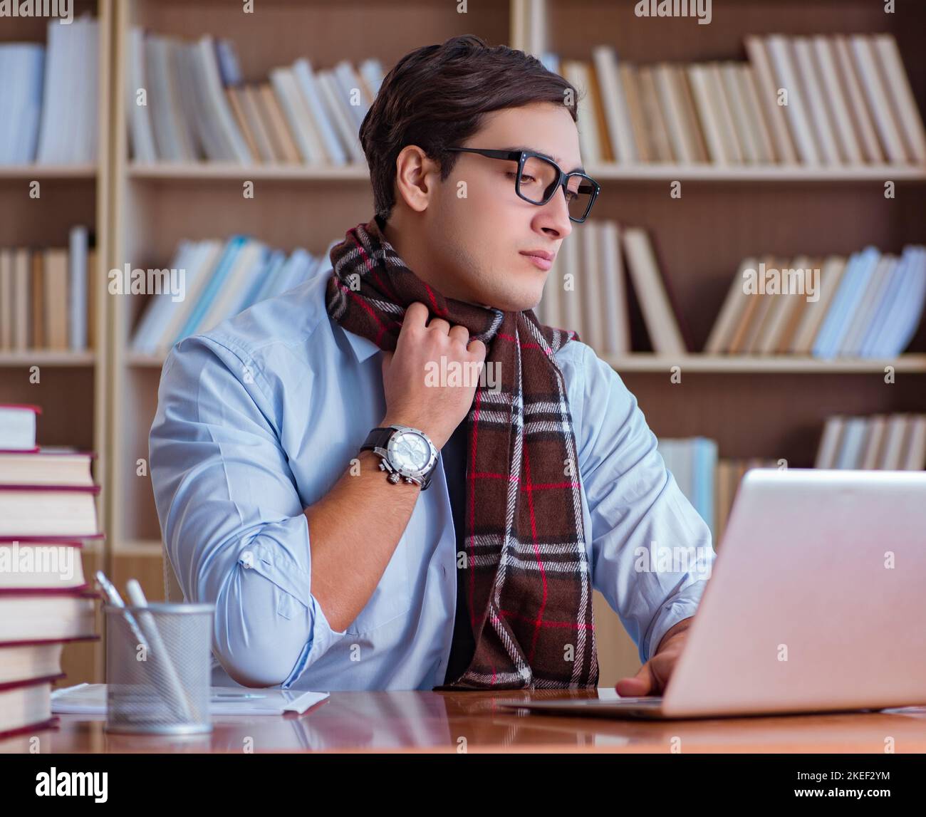 The young book writer writing in library Stock Photo - Alamy