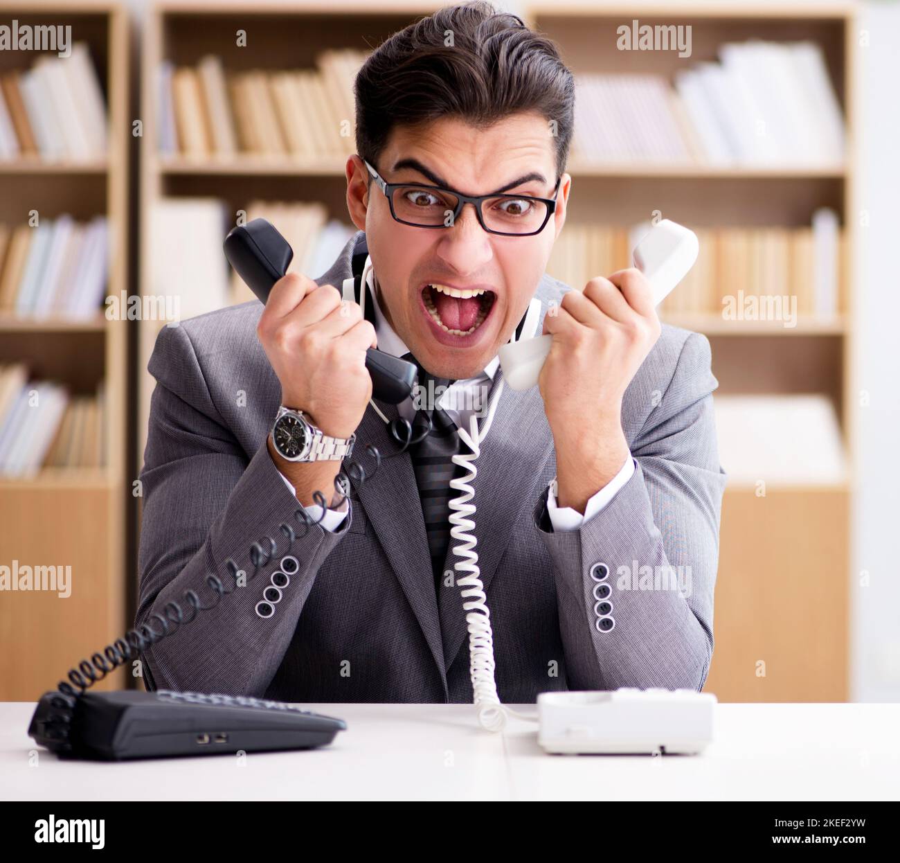 The angry helpdesk operator yelling in office Stock Photo - Alamy