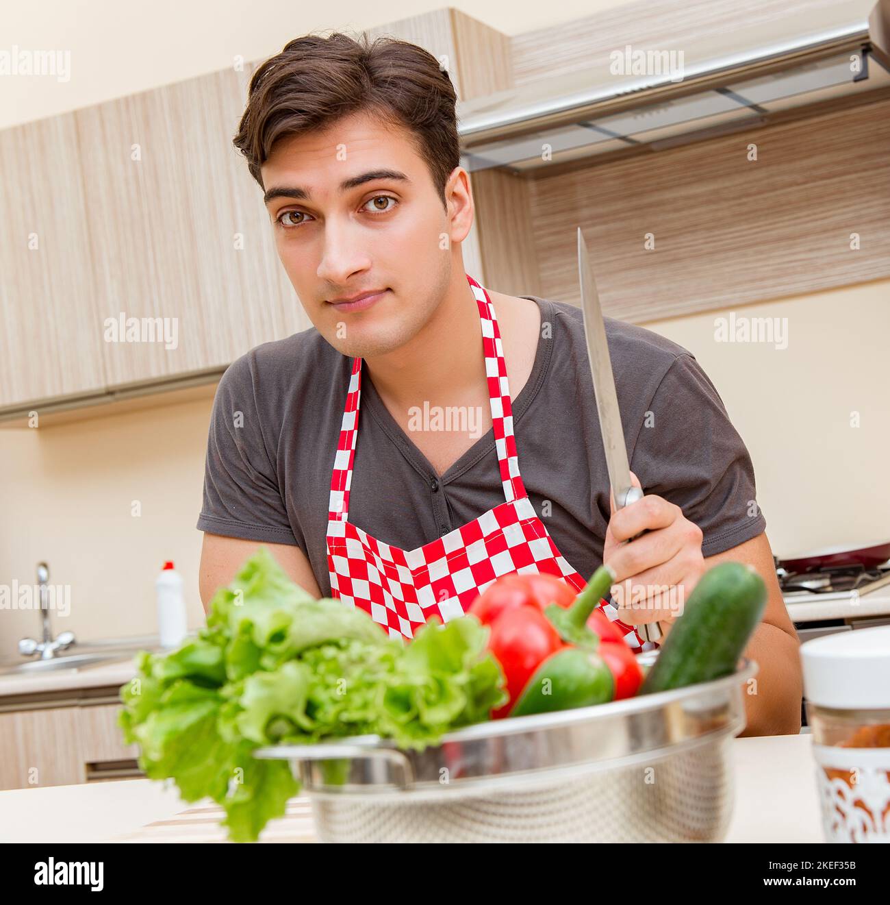 The man male cook preparing food in kitchen Stock Photo - Alamy