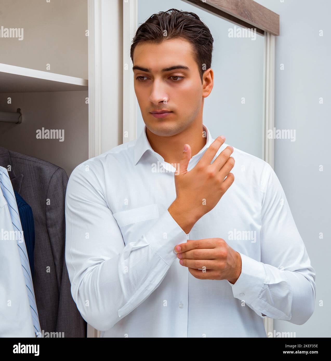 The businessman dressing up for work Stock Photo - Alamy