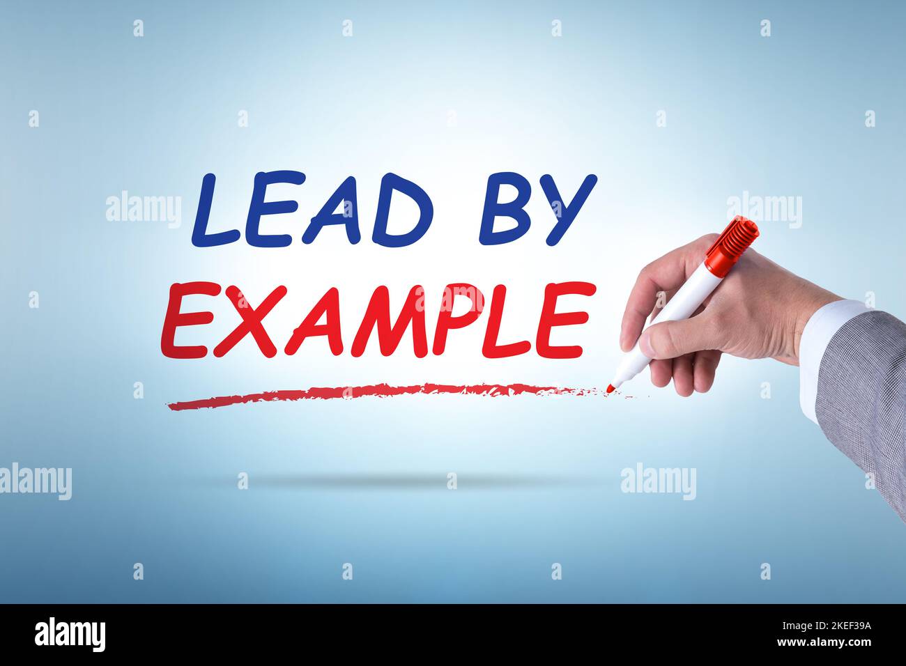 Lead by example concept in the motivational concept Stock Photo - Alamy