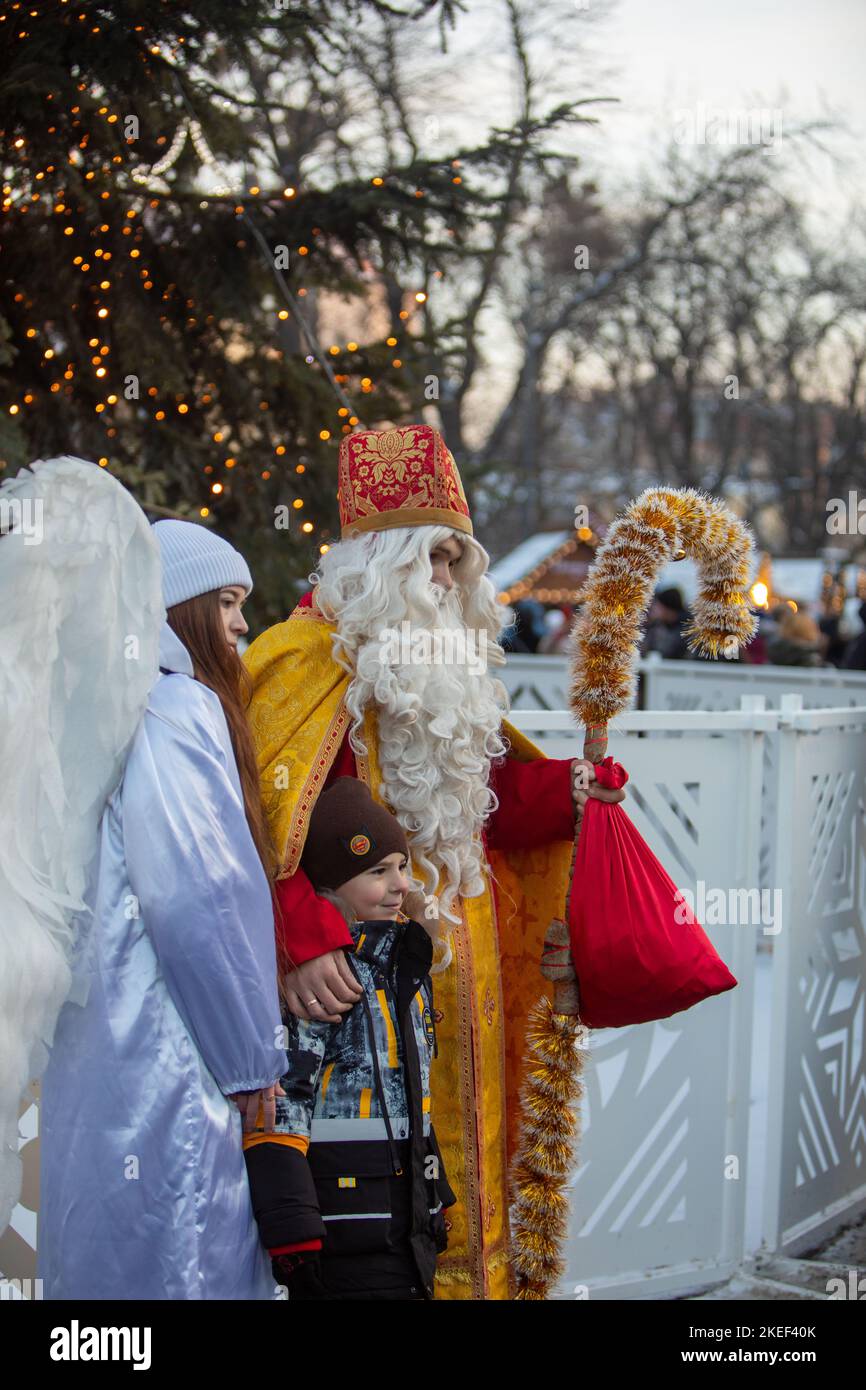 Lviv, Ukraine - December 26, 2021: children taking picture with santa ...