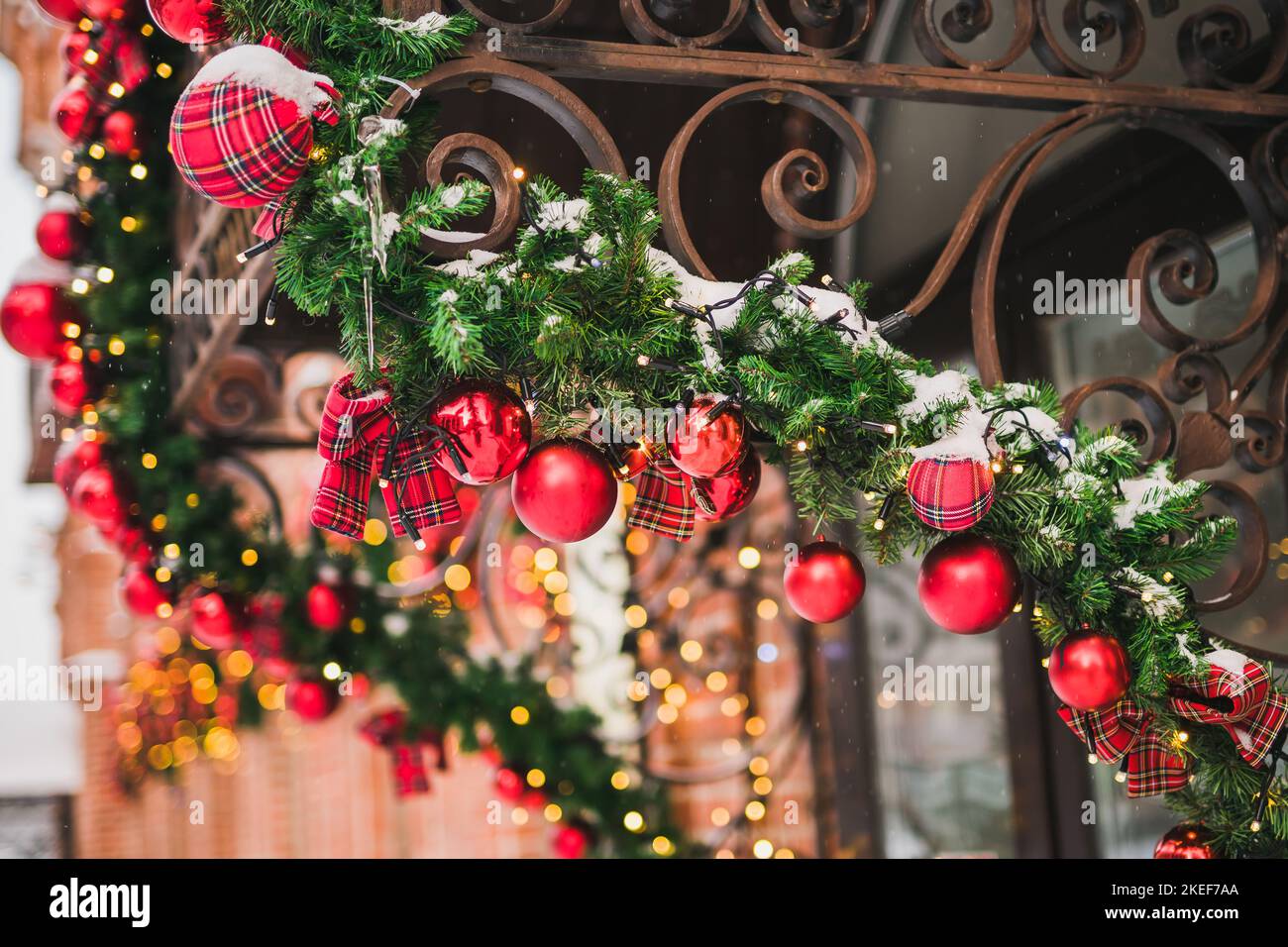 Building front decorated to Christmas with christmas trees fir branches ...
