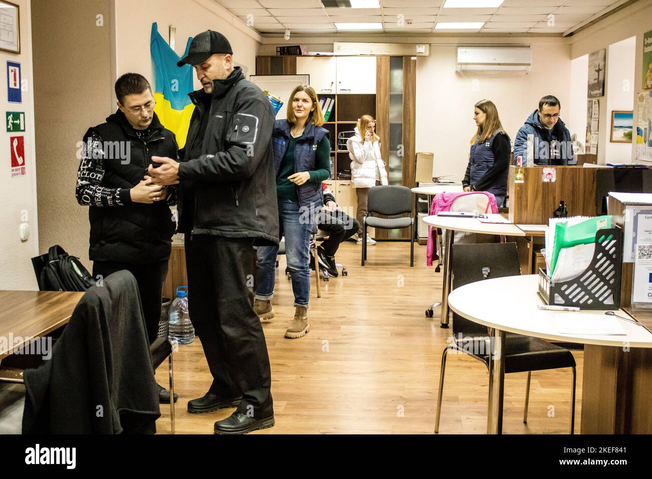 Volunteers working at the office of Dnipro Caritas refugee center ...
