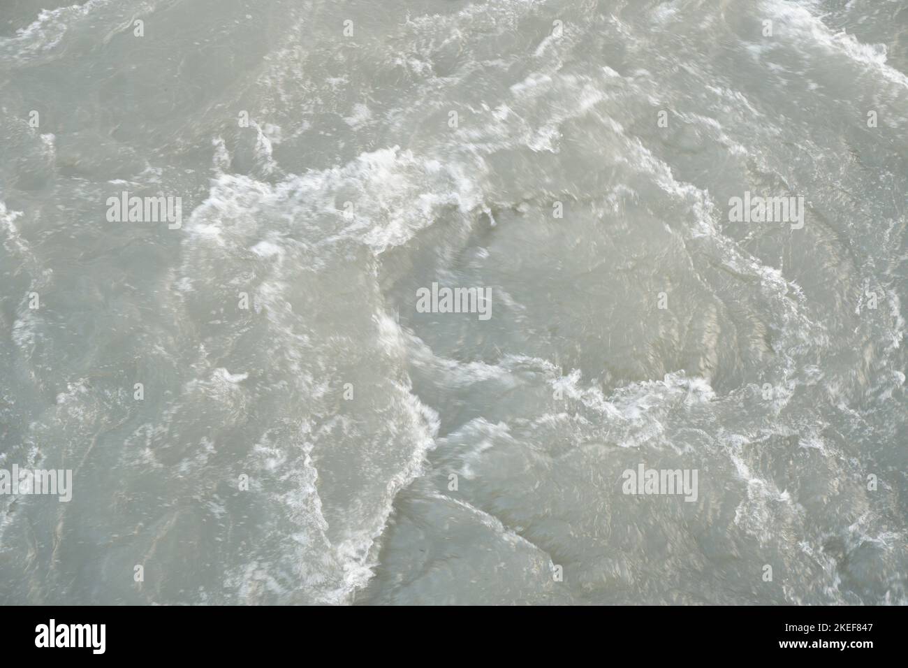 Fast moving whisky water on current stream river waves in the river ...