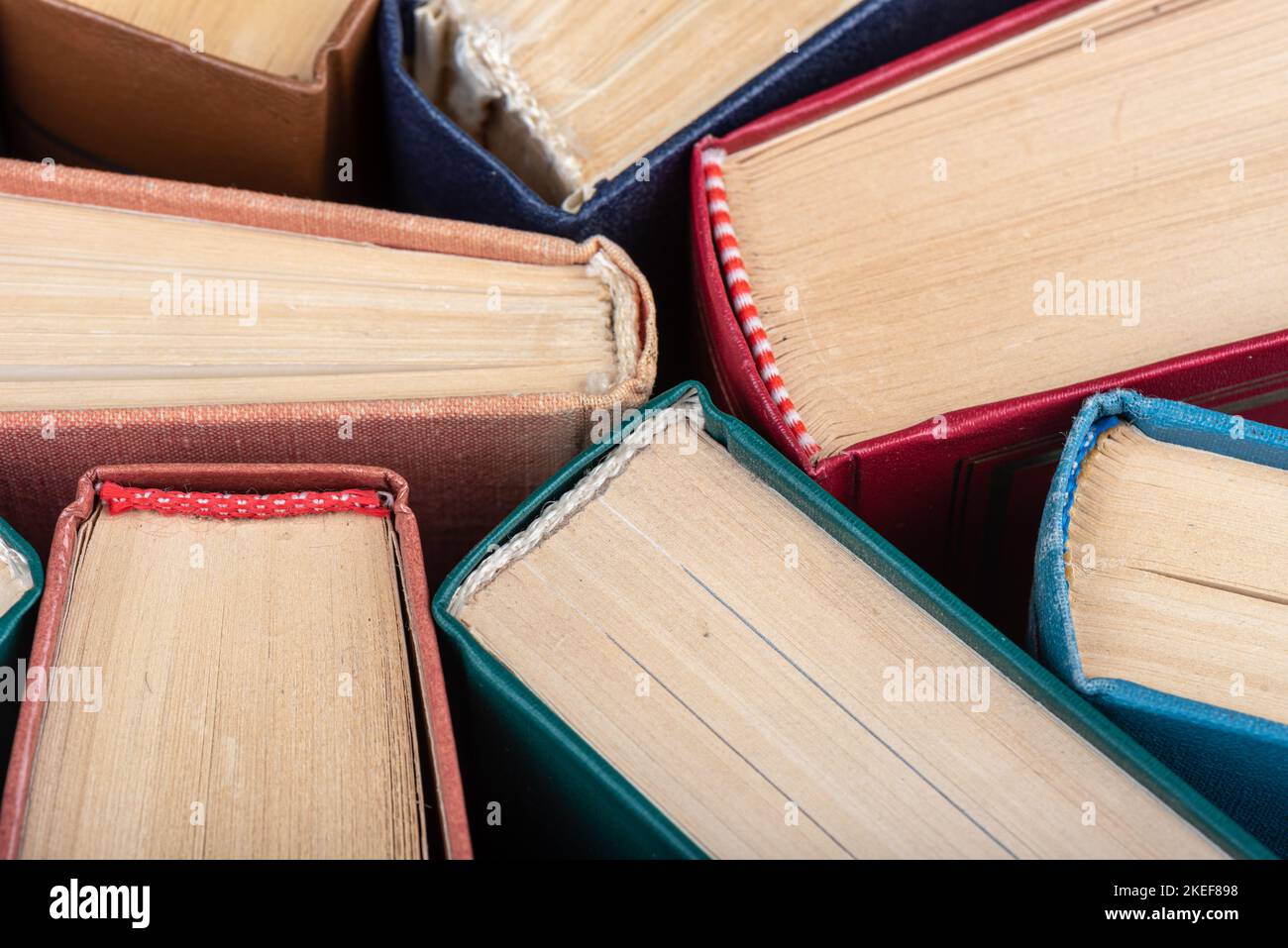 The spines of old books close up as a background. Knowledge concept Stock Photo - Alamy