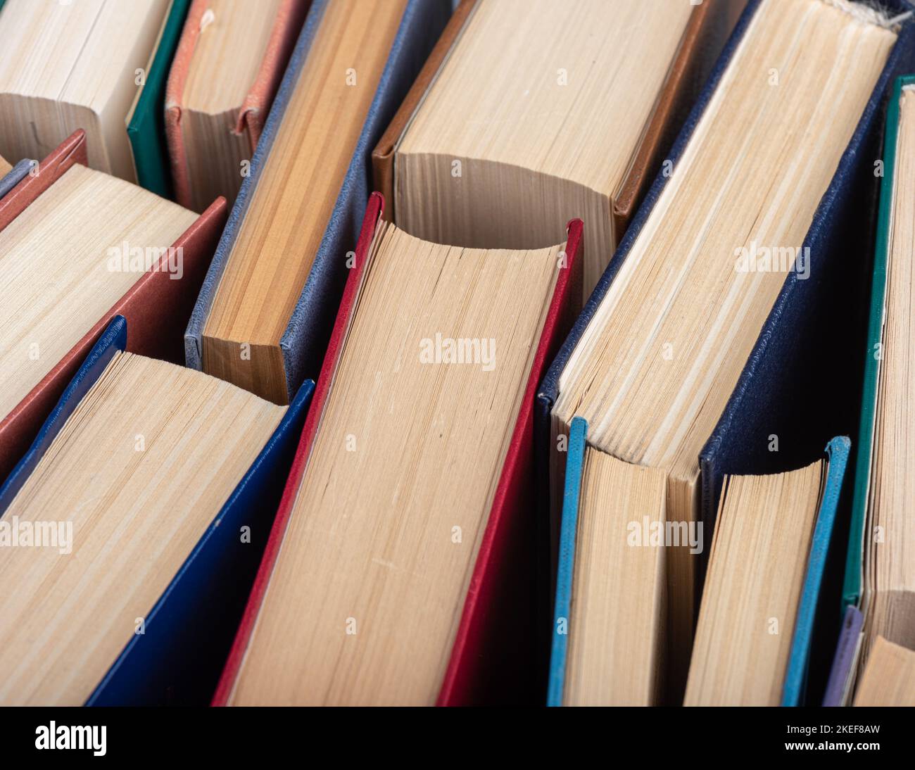 Close-up background of old hardcover paper books. Knowledge concept ...