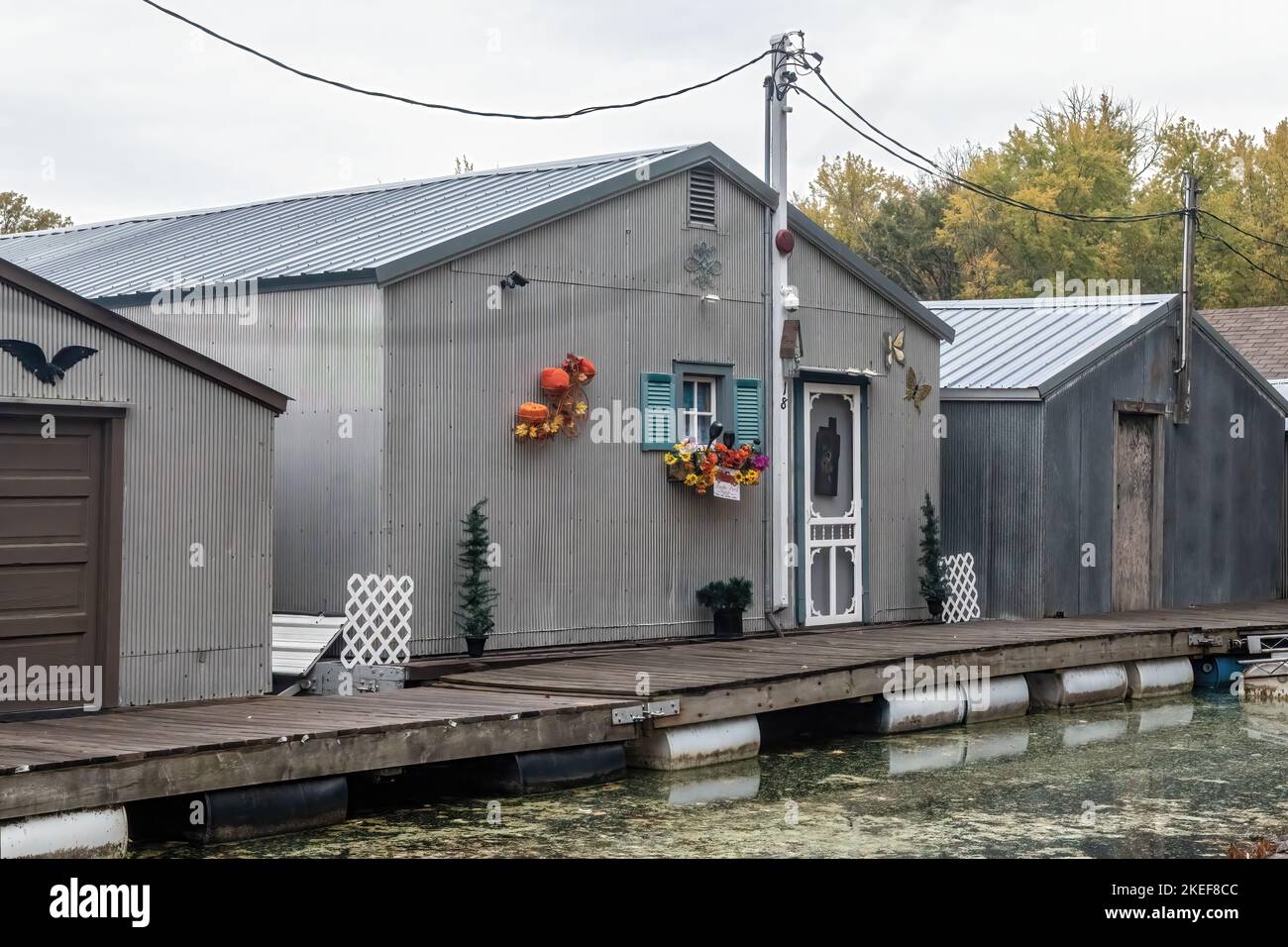 Row of old aluminum or steel boat houses on Latsch Island in the ...