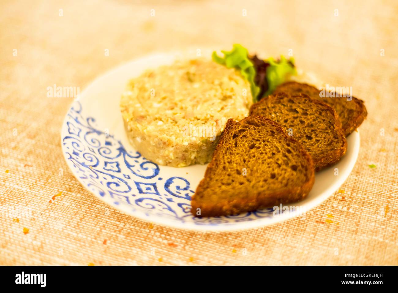 National Jewish food snack. Minced herring on an ethnic plate and ...