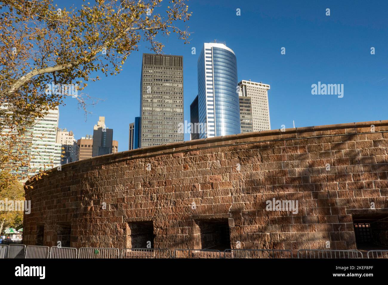 The skyline of lower Manhattan looms over historic Castle Clinton in ...