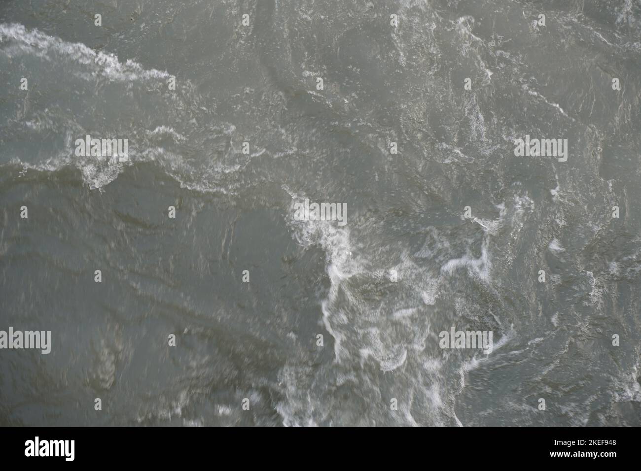 Fast moving whisky water on current stream river waves in the river ...